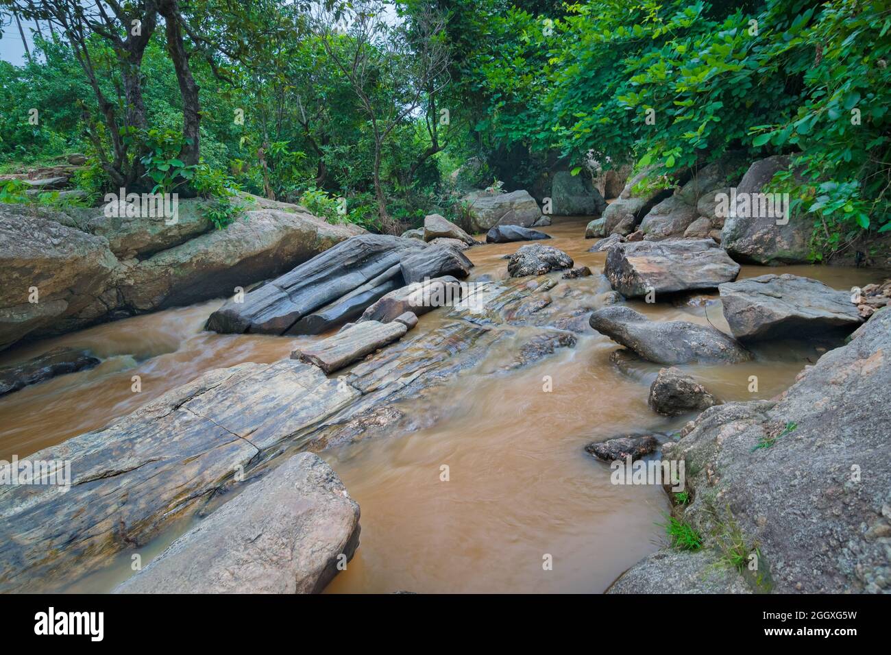 Beautiful Bamni waterfall having full streams of water flowing downhill ...