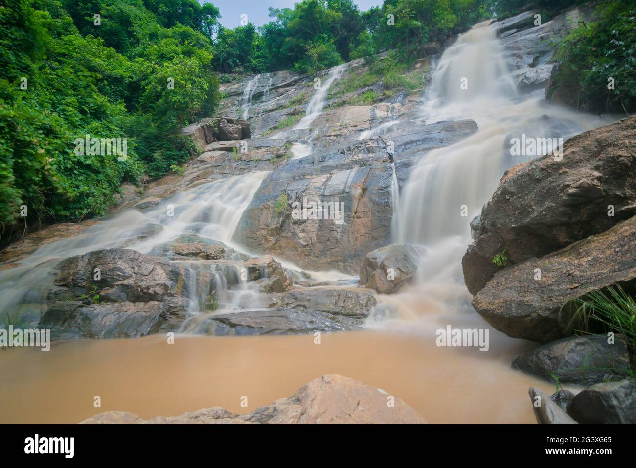 Beautiful Bamni waterfall having full streams of water flowing downhill ...
