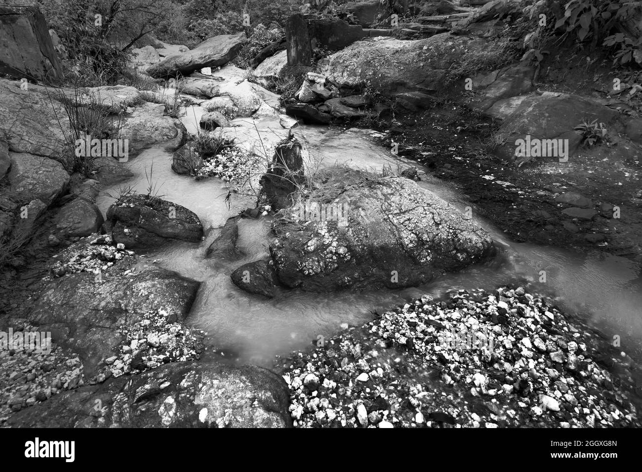 Beautiful Bamni waterfall having full streams of water flowing downhill ...