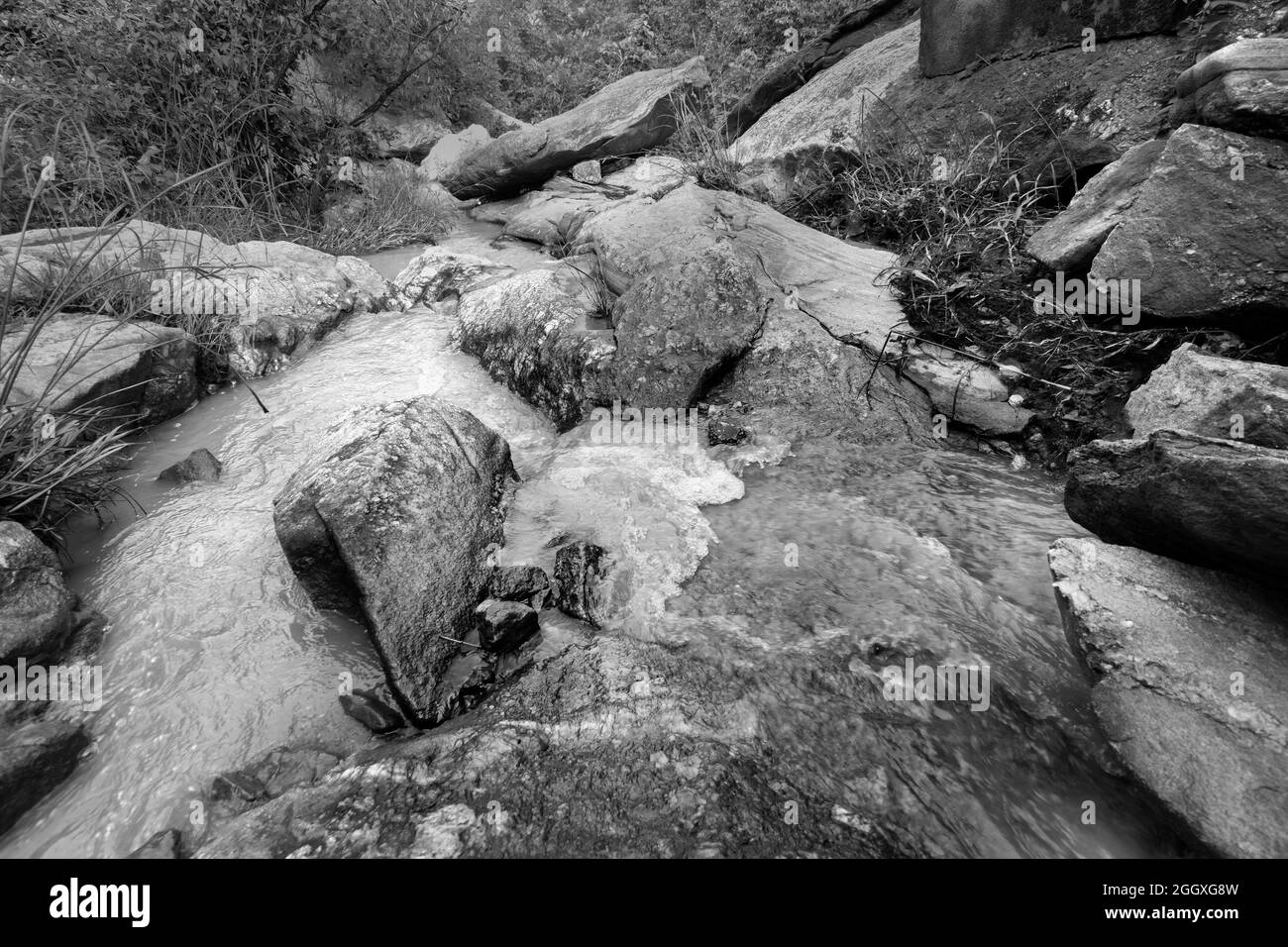 Beautiful Bamni waterfall having full streams of water flowing downhill ...