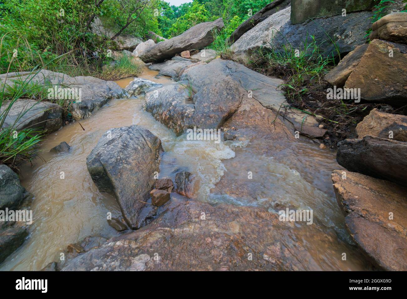 Beautiful Bamni waterfall having full streams of water flowing downhill ...