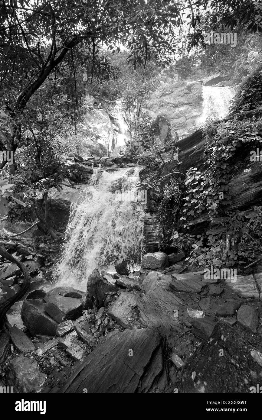 Beautiful Bamni waterfall having full streams of water flowing downhill ...