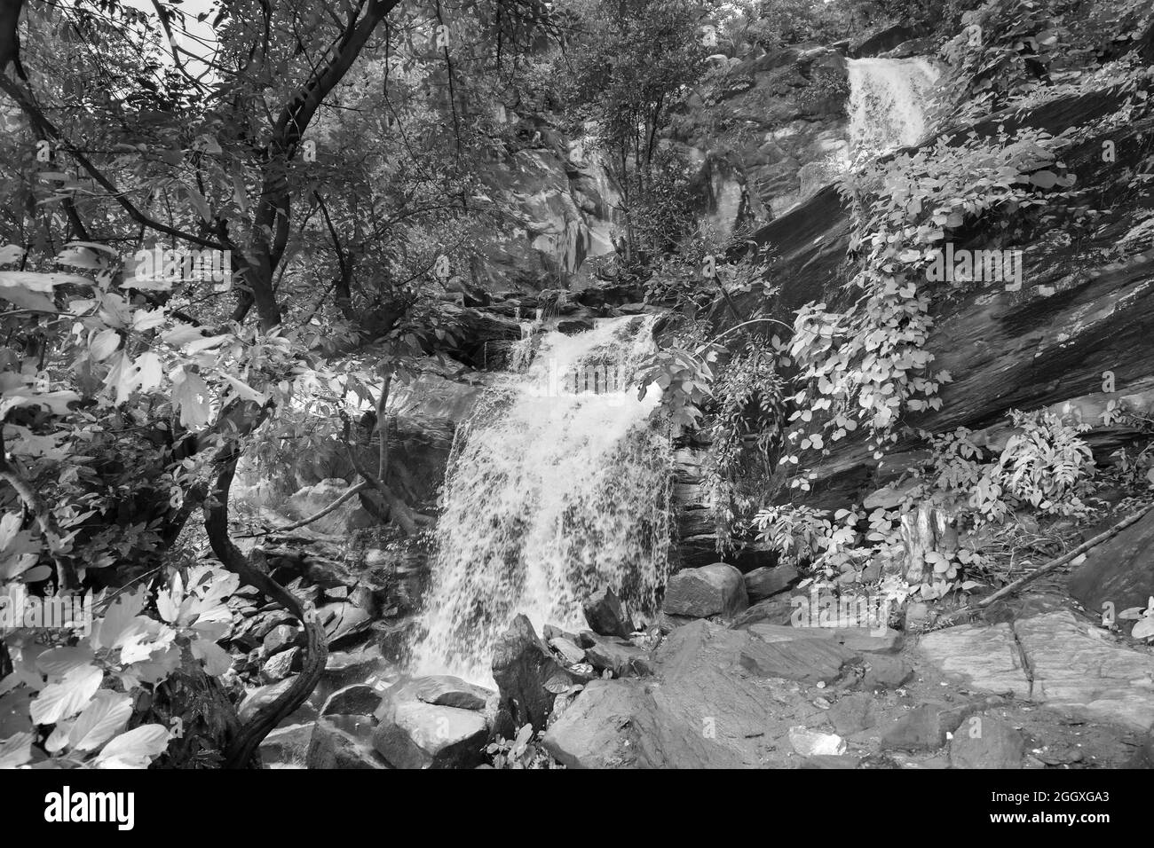 Beautiful Bamni waterfall having full streams of water flowing downhill ...