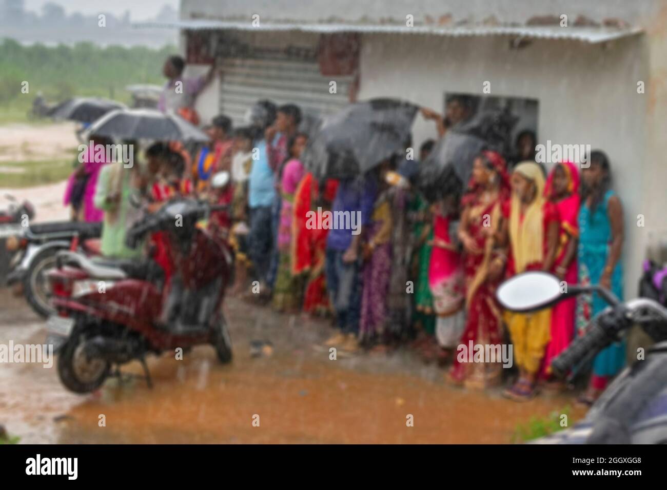 Blurred image of moody image of monsoon, rural people taken shelter ...