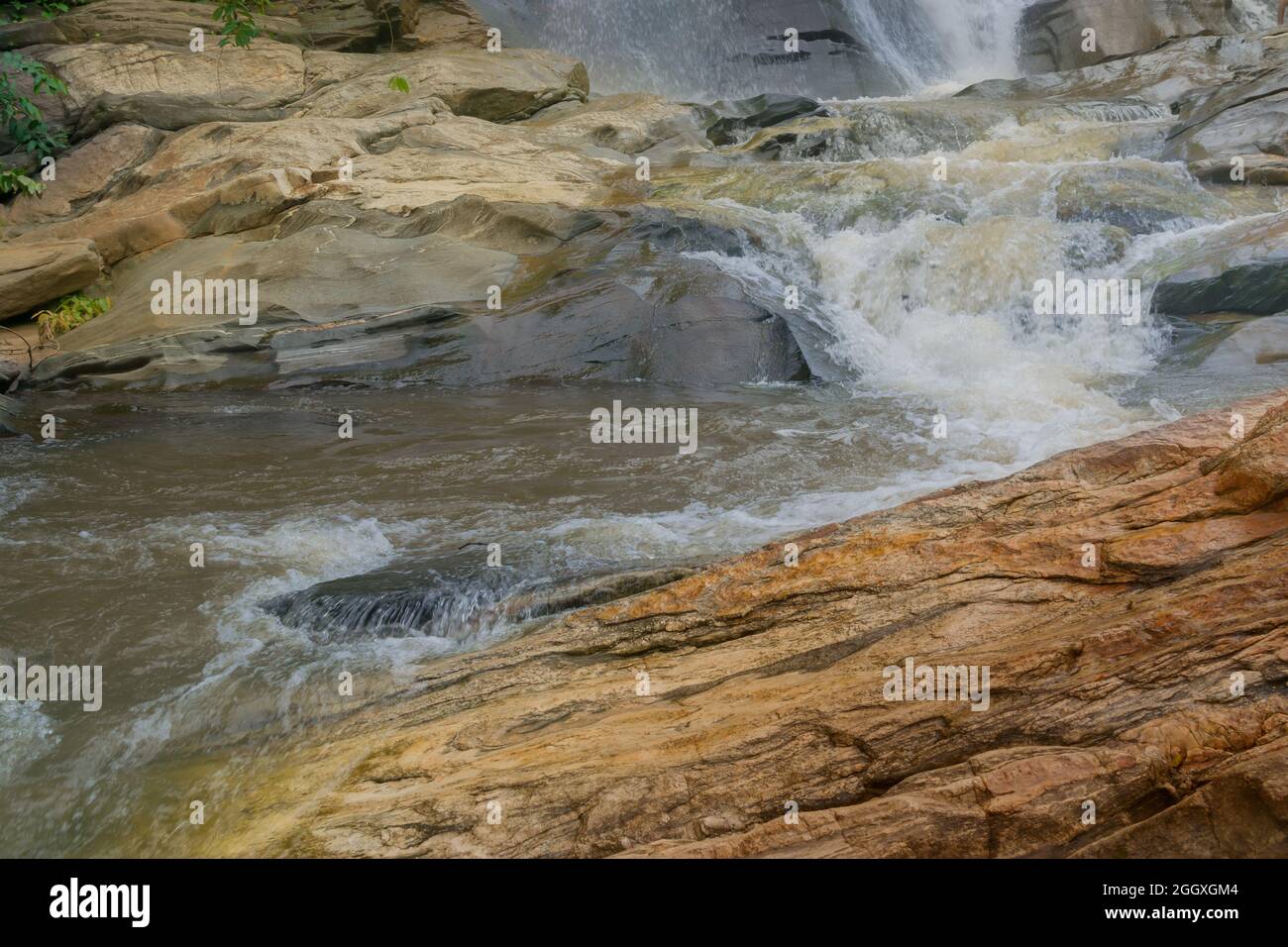 Beautiful Turga waterfall having full streams of water flowing downhill ...