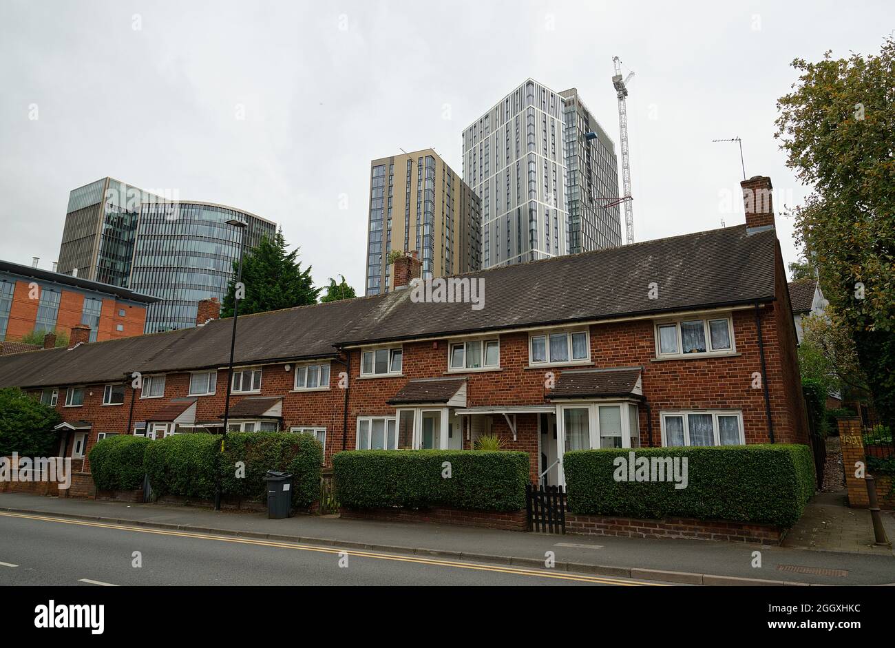 Old housing (1970's) and modern central Birmingham buildings behind ...