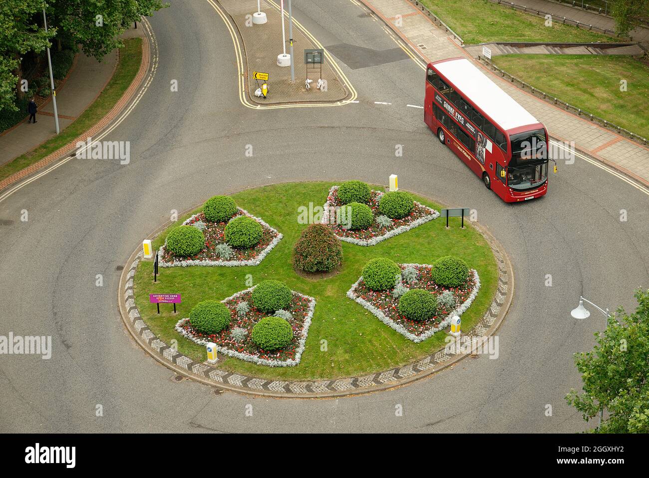 A roundabout or traffic circle. Attractively planted as a nice feature ...