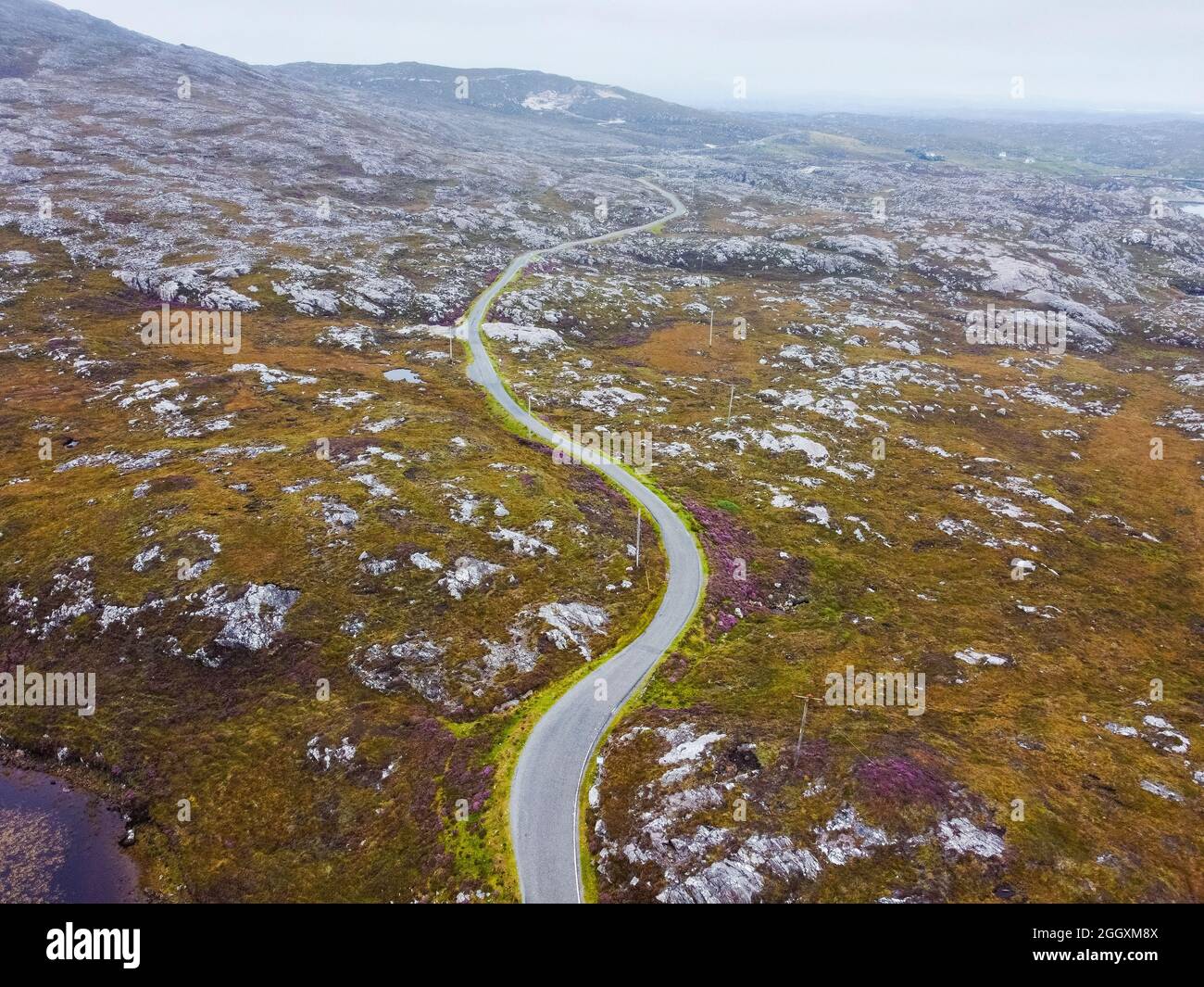 Aerial view from drone of narrow road and rocky landscape on The Bays ...