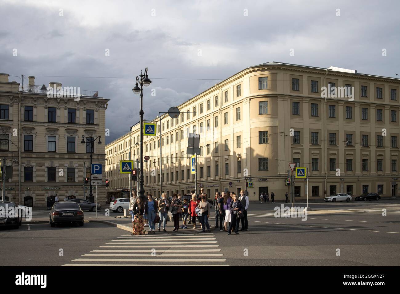 Saint Petersburg, Russia - 9 August 2021, People cross the road on a ...