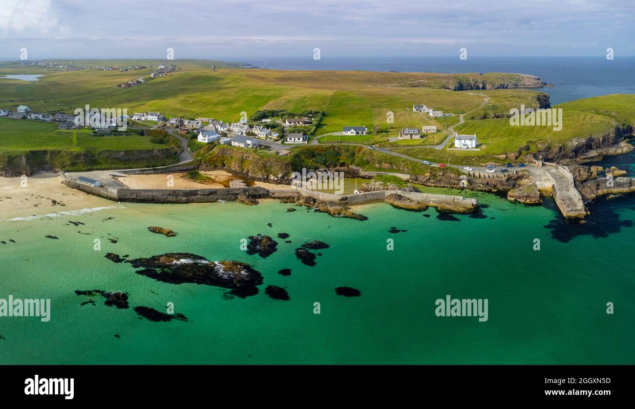 Aerial view from drone of village and harbour at Port Ness at northern ...