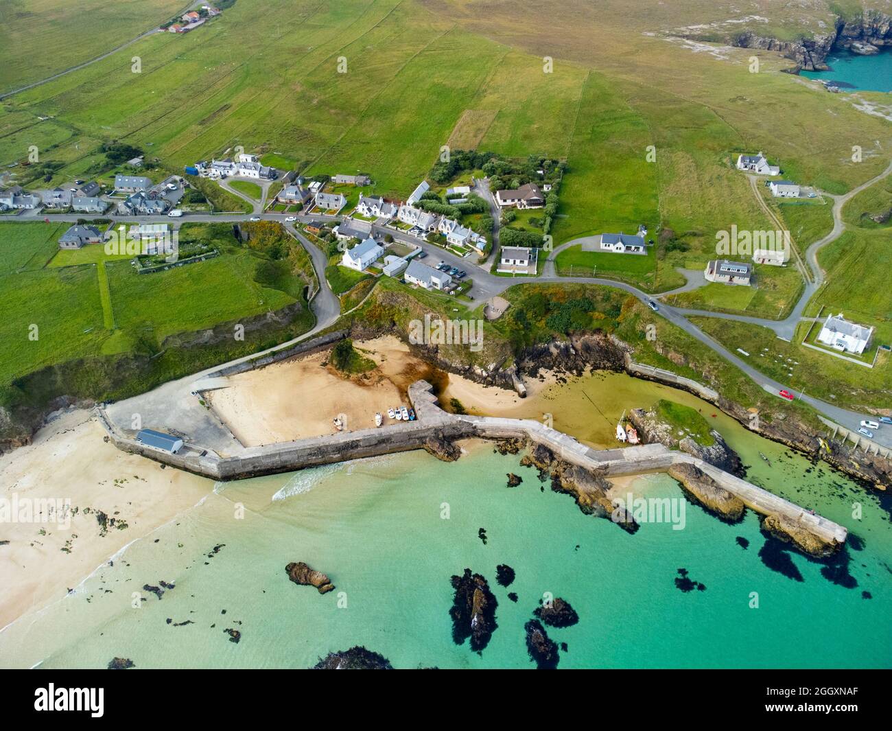Aerial view from drone of village and harbour at Port Ness at northern ...