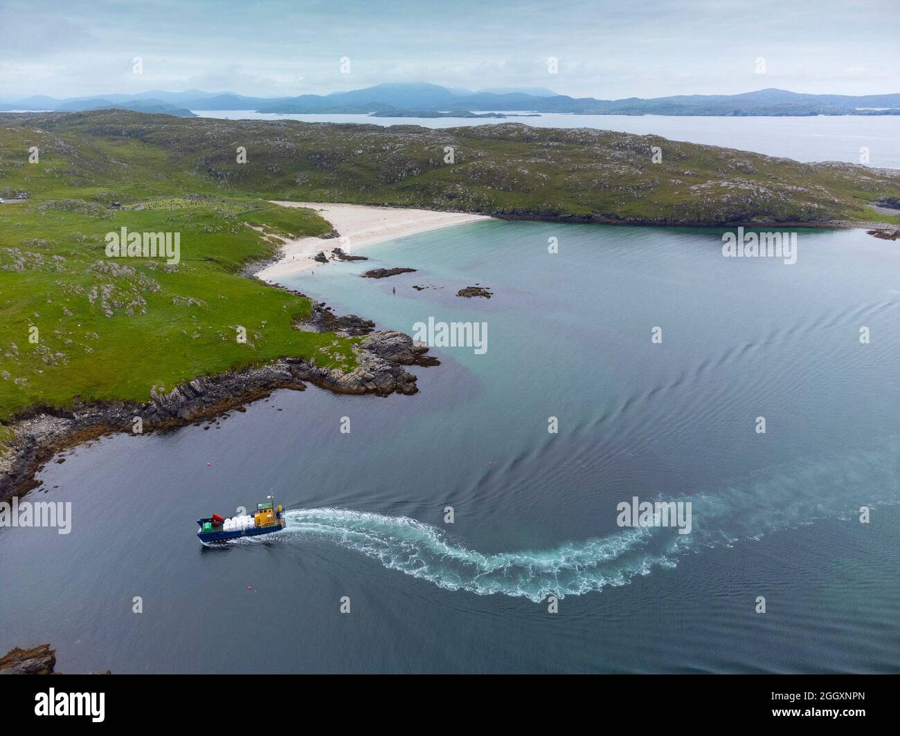 Aerial view from drone of fishing boat sailing between channel between ...