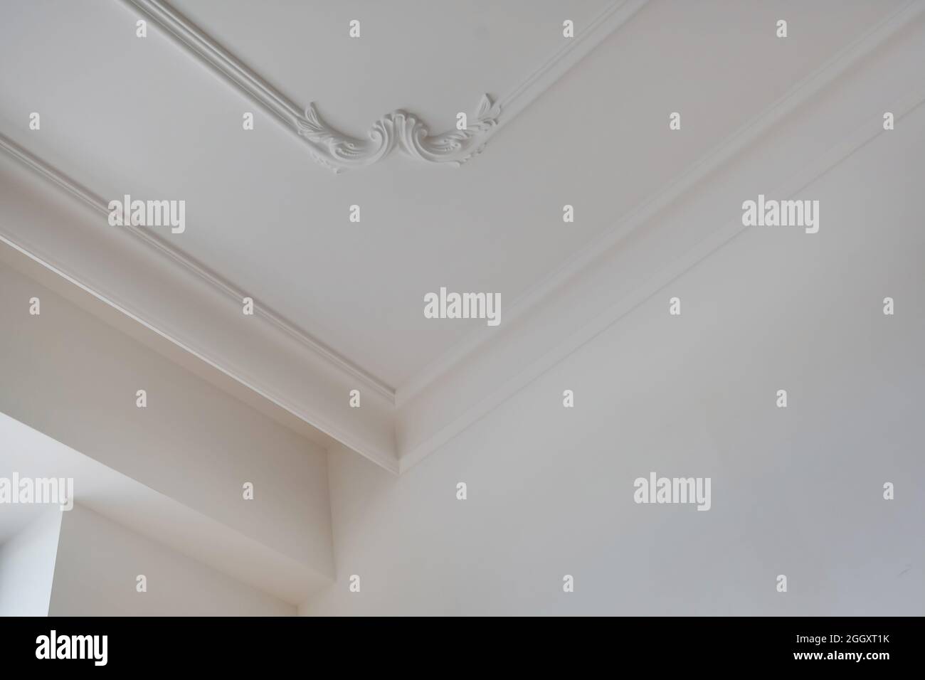 corner of ceiling and walls with intricate crown moulding. Interior ...