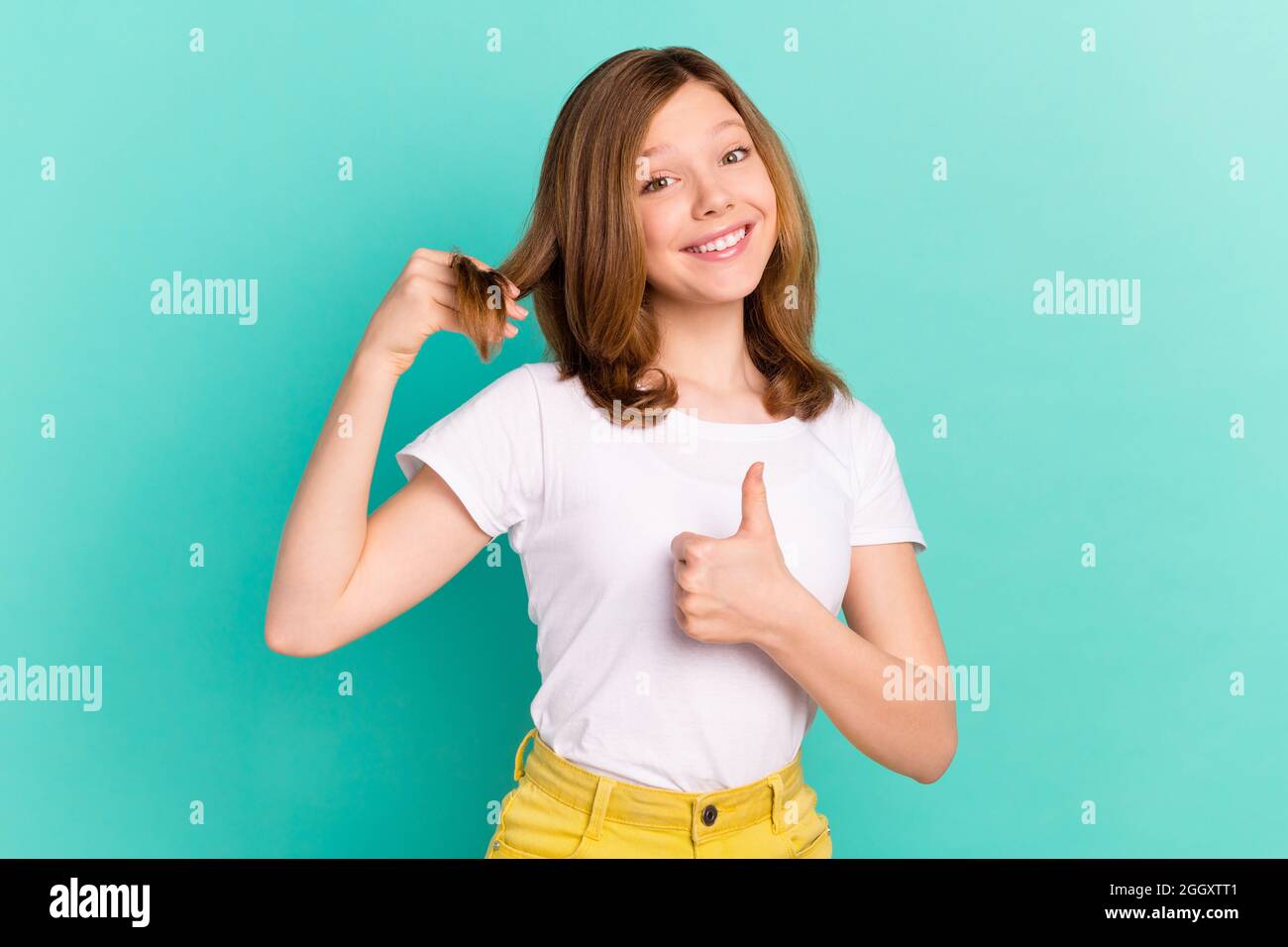 Photo portrait girl showing hair ends thumb-up gesture isolated vibrant ...