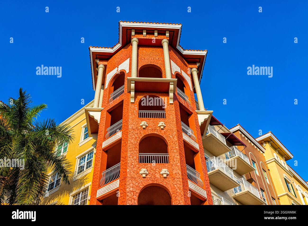 Colorful condos buildings with orange yellow colors corner, facade ...