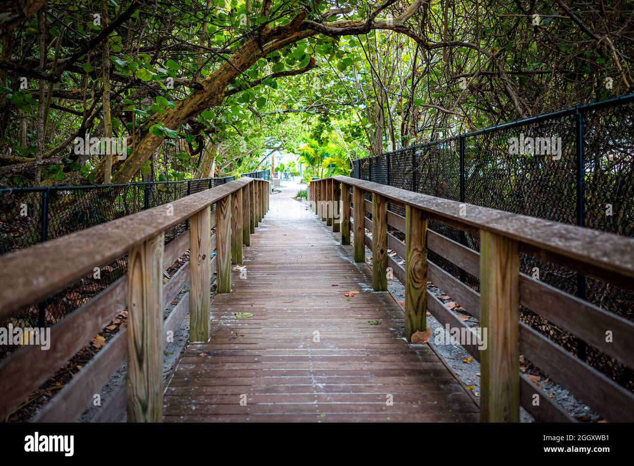 Sidewalk wooden access boardwalk leading to Vanderbilt beach in Naples ...