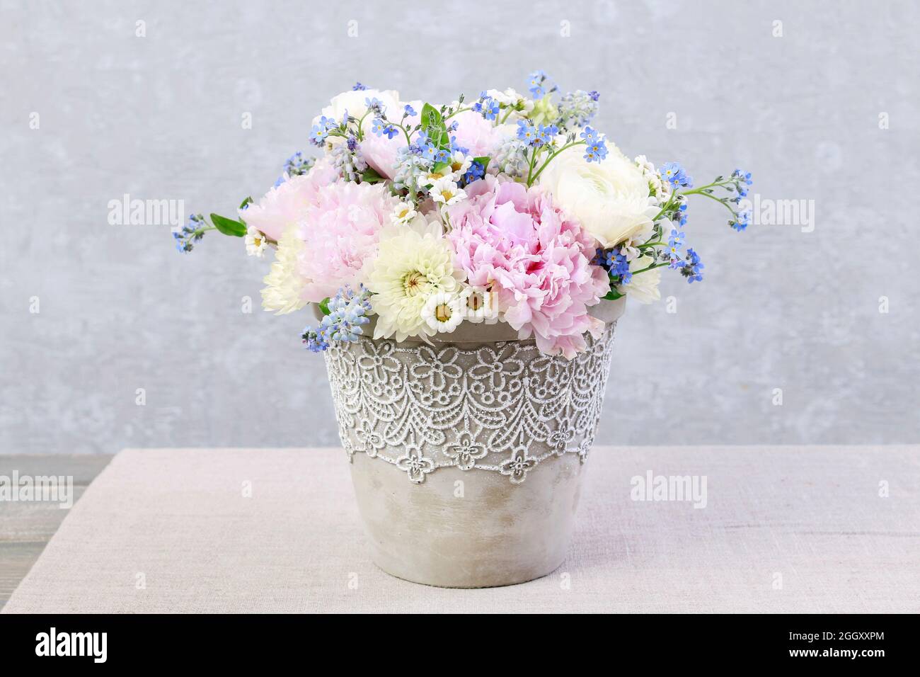 Floral arrangement with pink peonies, ranunculus flowers, white ...