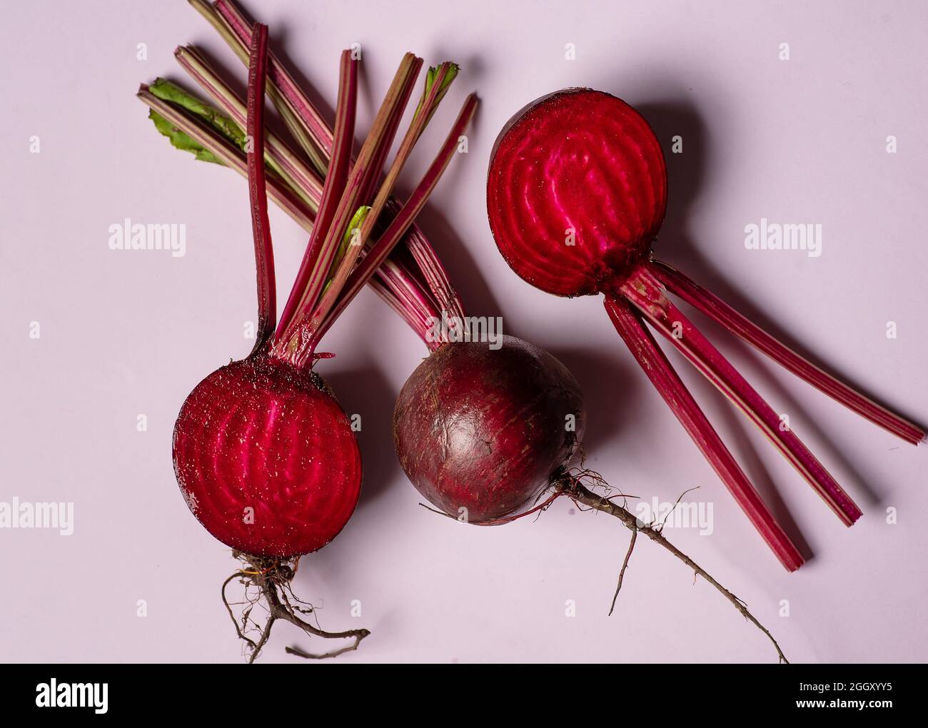 Common beet vegetable beetroot on pink background top view Stock Photo ...
