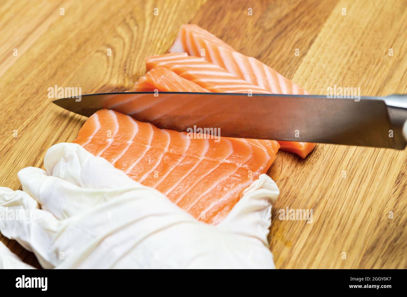 Chef cuts fish on cutting hi-res stock photography and images - Alamy