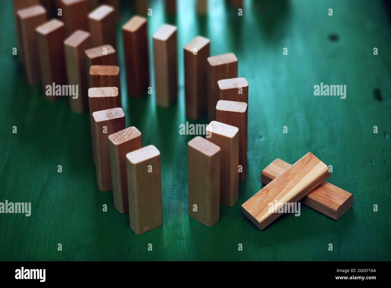 Stick wood block standing on stacked square wood blocks, abstract ...