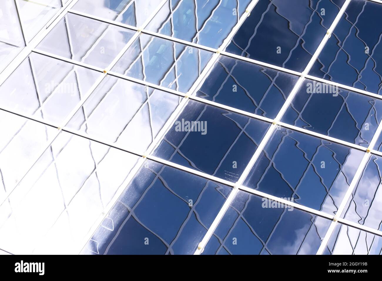 Architectural detail of the facade with multiple reflections of other ...