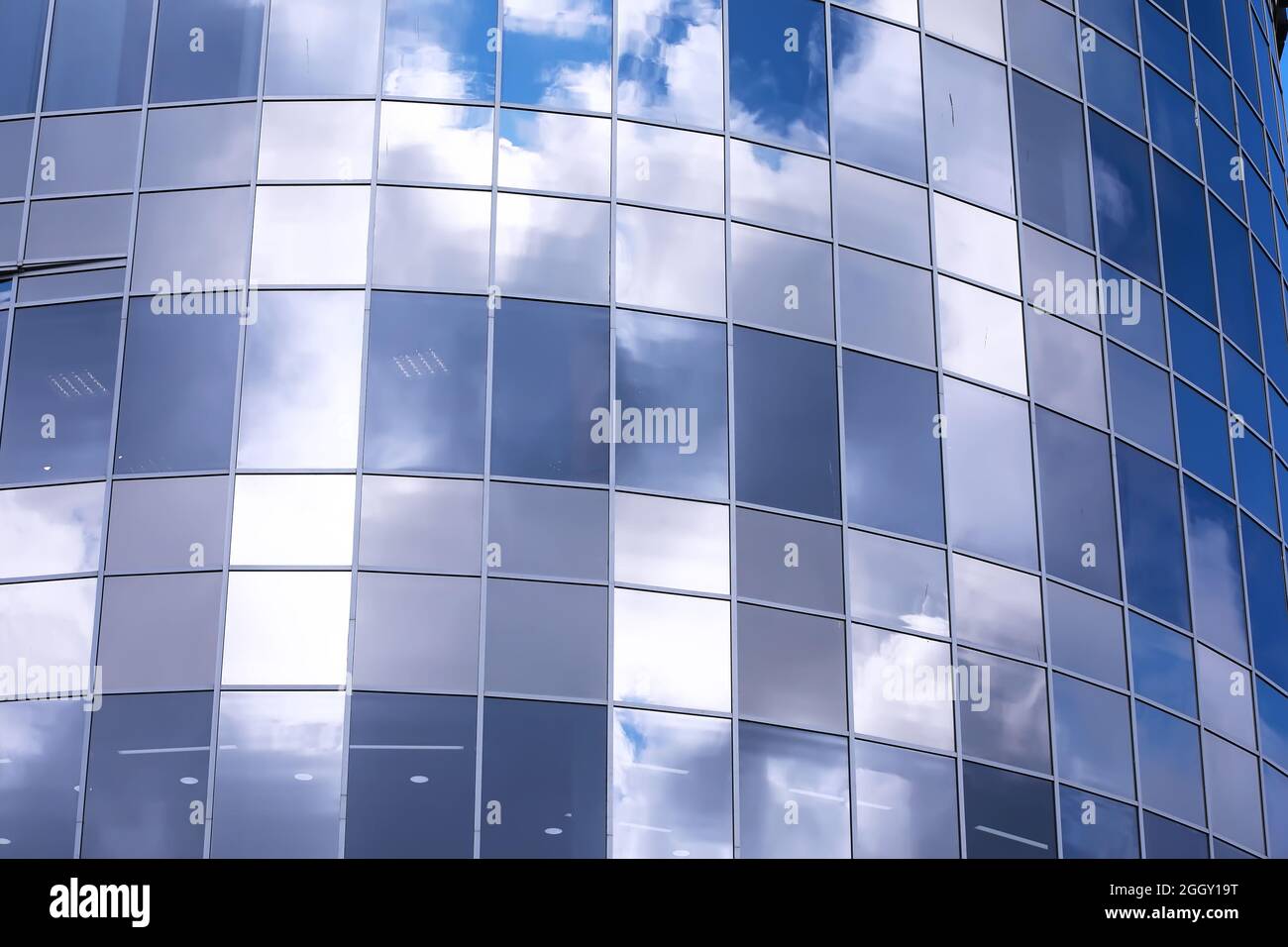 Architectural detail of the facade with multiple reflections of other ...