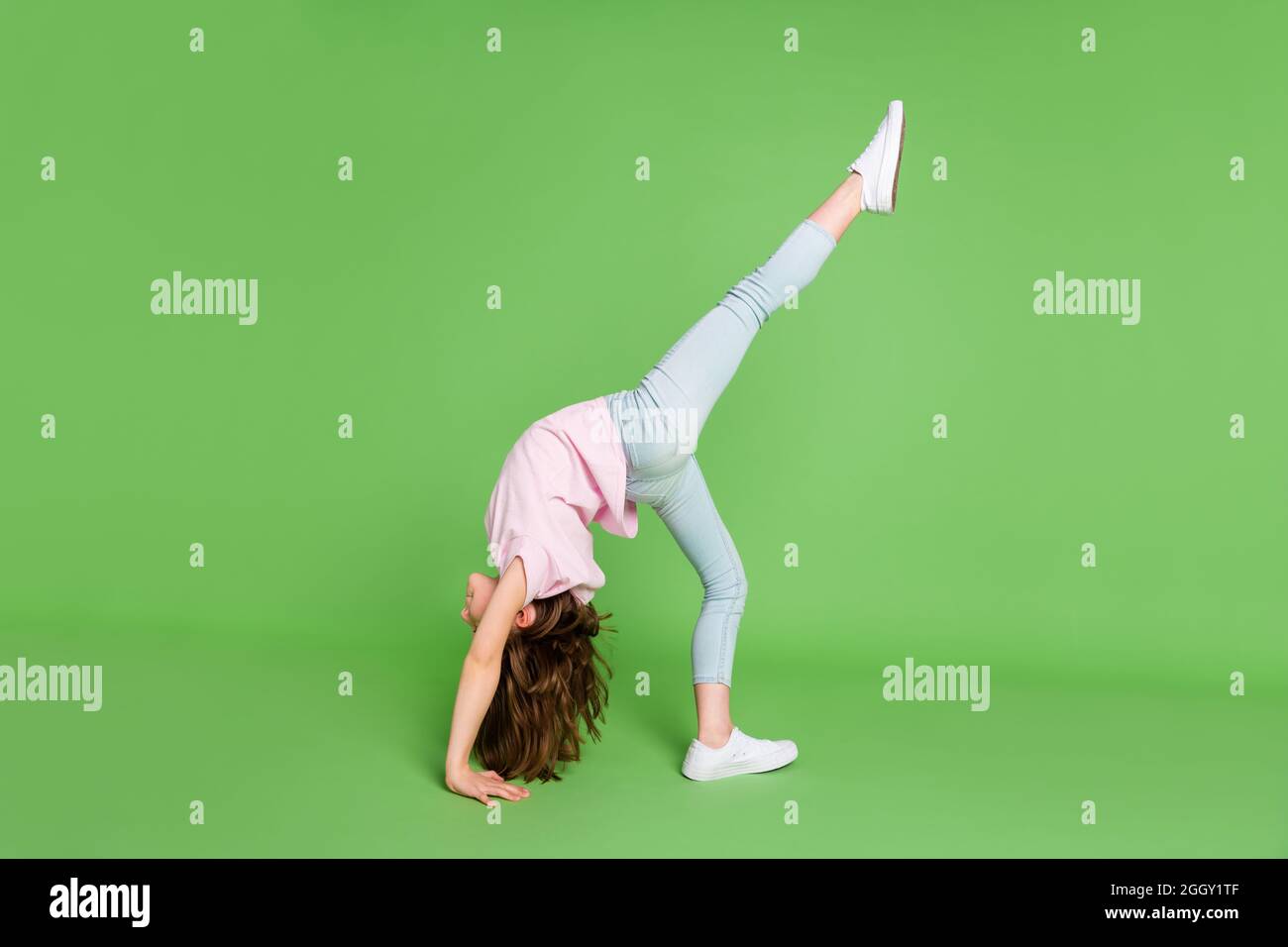 Full body profile side photo of young little girl stand bridge pose ...