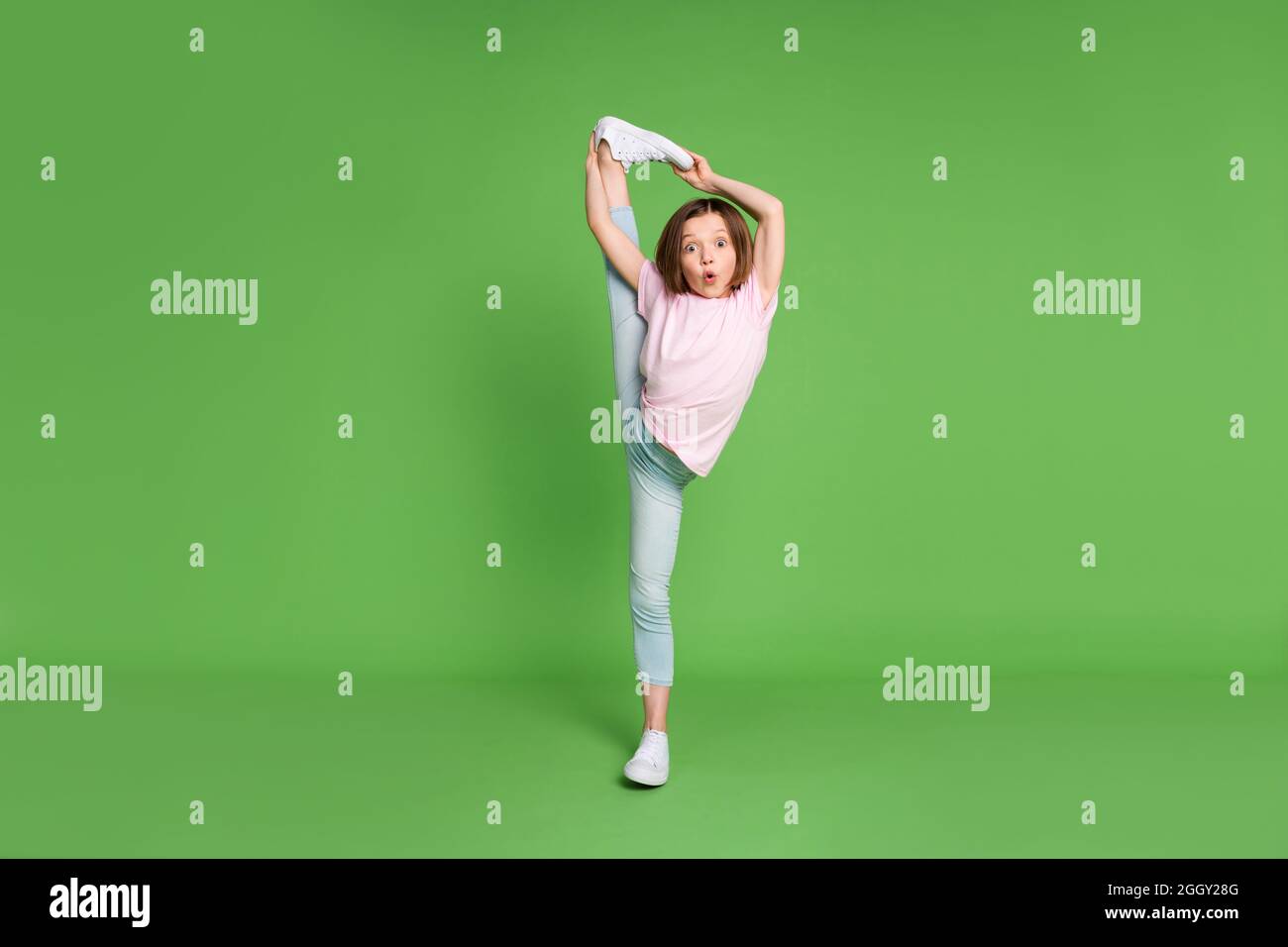Full size photo of young little girl hold leg stretch split gym ...