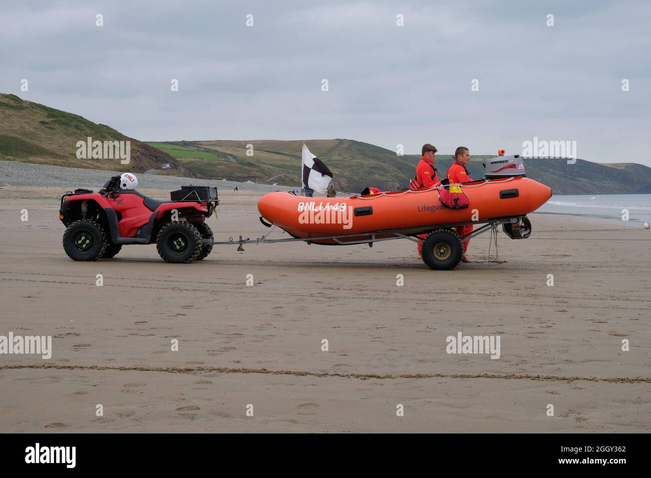 Newgale Pembrokeshire Wales 09.03.21 Sandy Beach. Orange dirigible boat ...