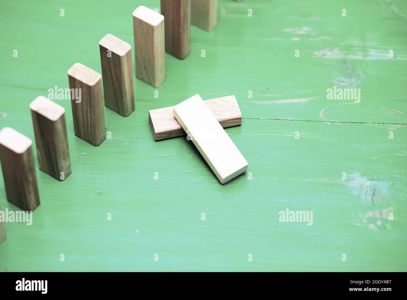 Stick wood block standing on stacked square wood blocks, abstract ...