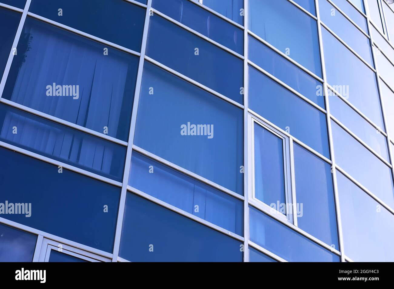 Architectural detail of the facade with multiple reflections of other ...