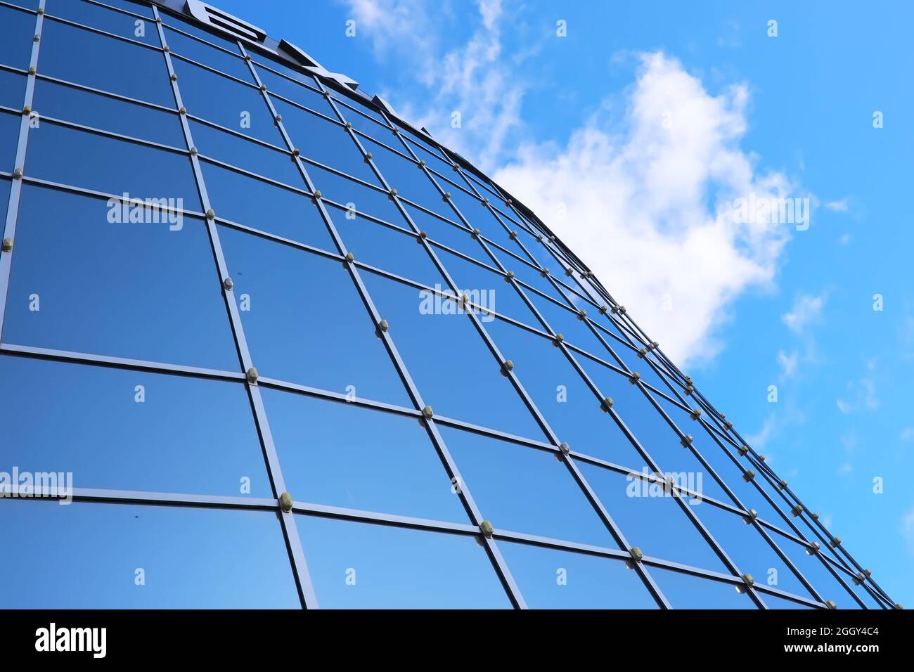 Architectural detail of the facade with multiple reflections of other ...
