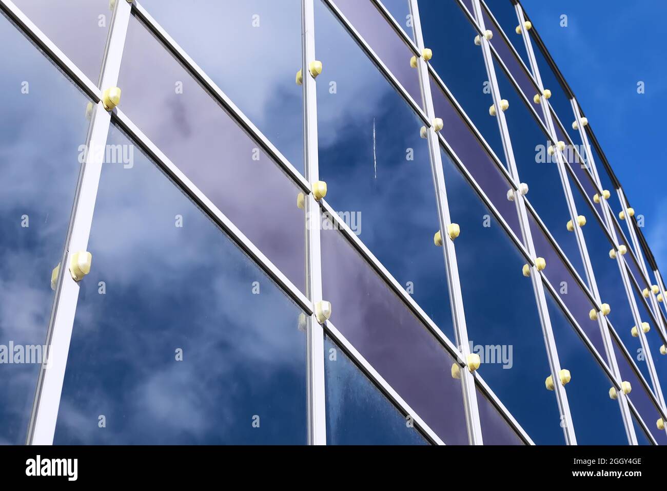 Architectural detail of the facade with multiple reflections of other ...