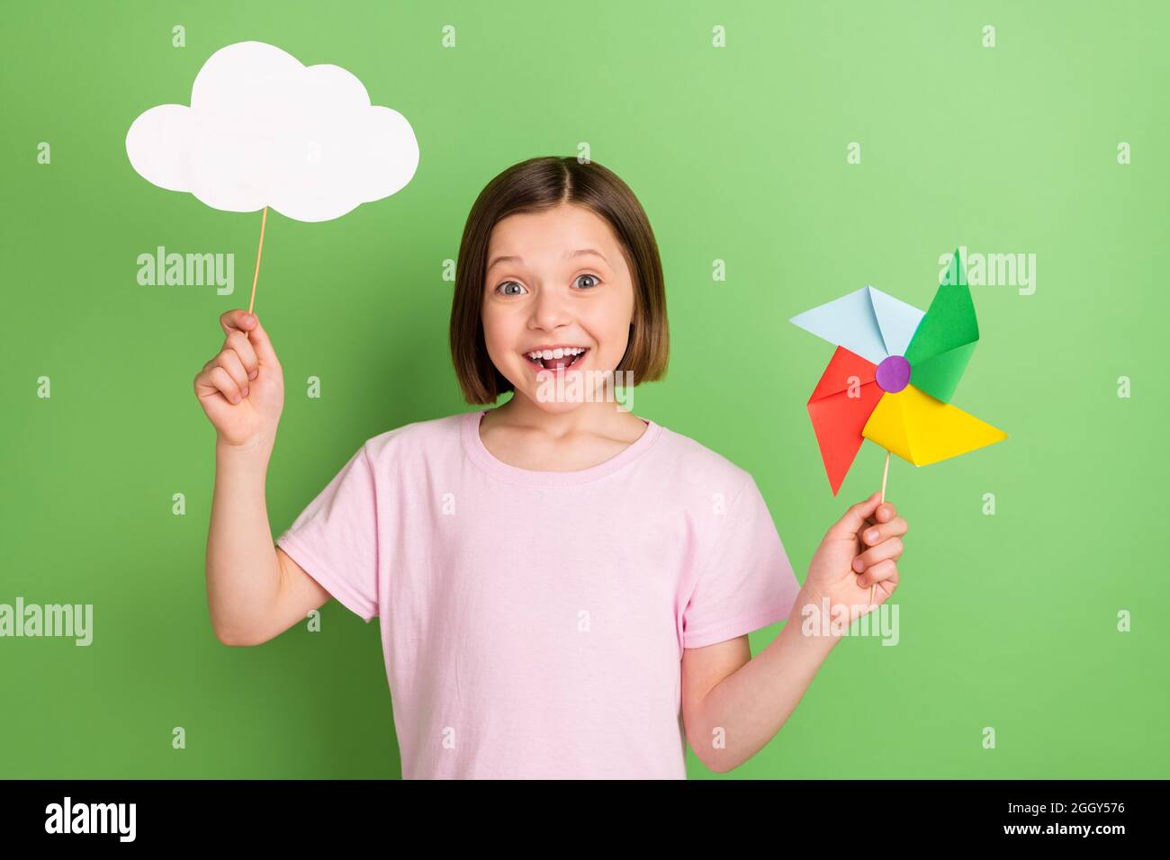 Photo of young excited girl happy positive smile hold paper cloud ...