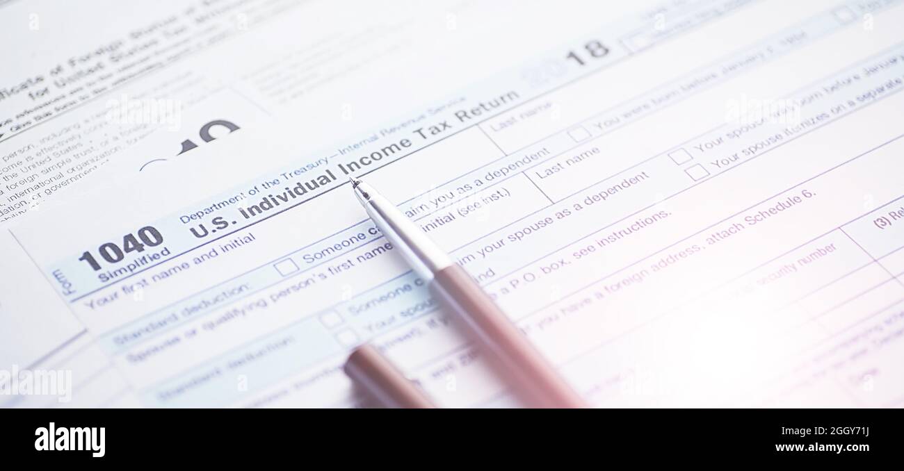 Annual tax reporting. Tax form on the table. Financial statements ...