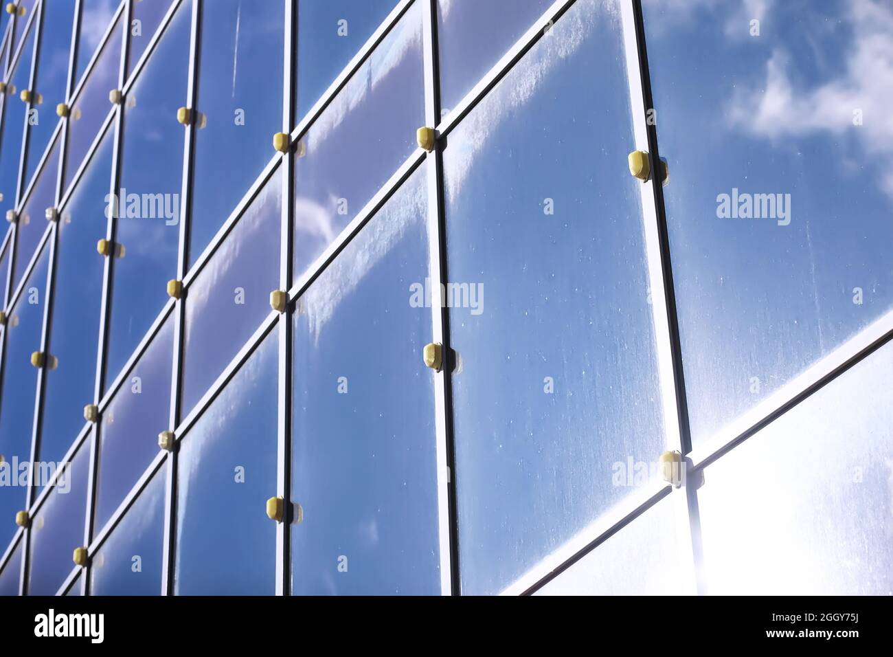 Architectural detail of the facade with multiple reflections of other ...
