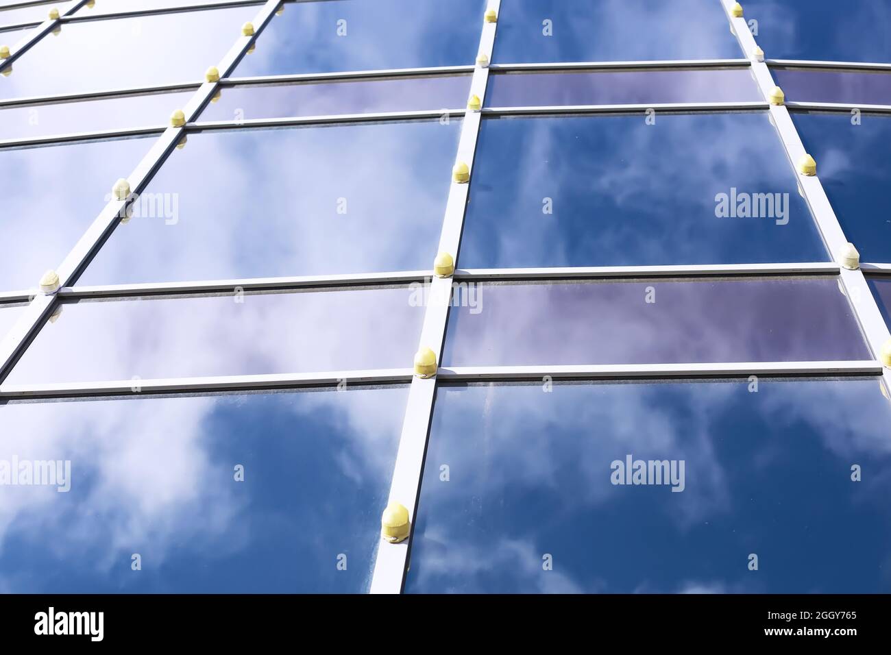 Architectural detail of the facade with multiple reflections of other ...