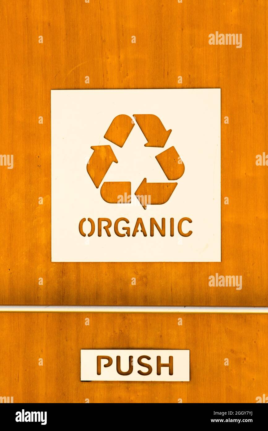 Organic recycling logo on a wooden door Stock Photo - Alamy