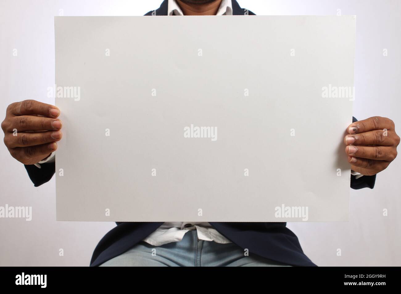 Close up of a businessman holding a blank form. blank for placement of ...