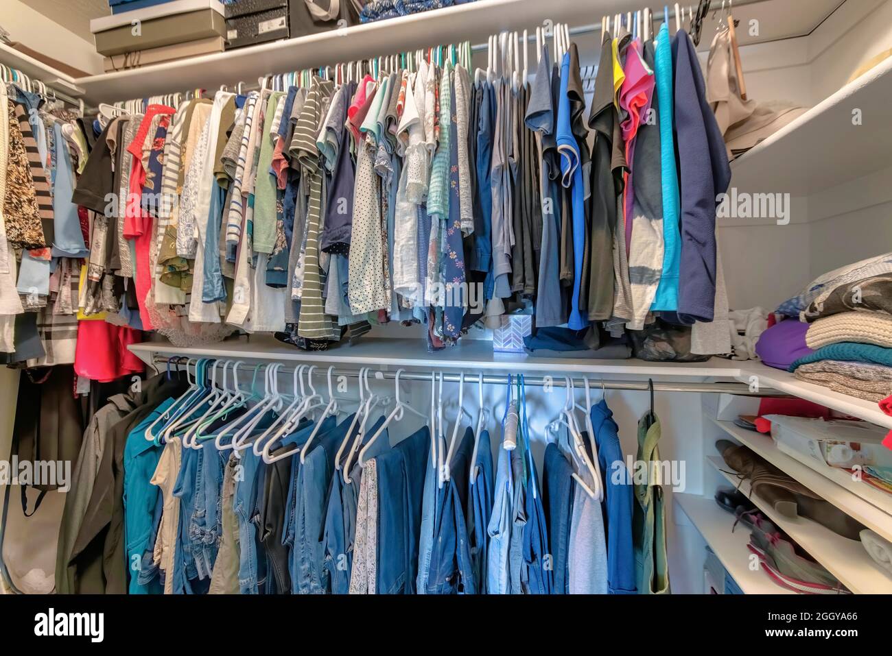 Walk in closet interior of a house with open shelving unit Stock Photo ...