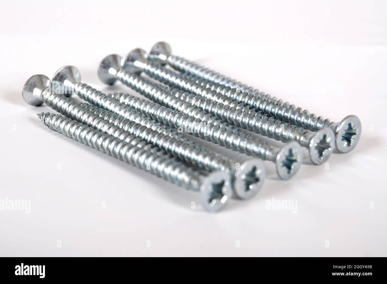 Chrome metal screw and on isolated white background, crosshead screw ...
