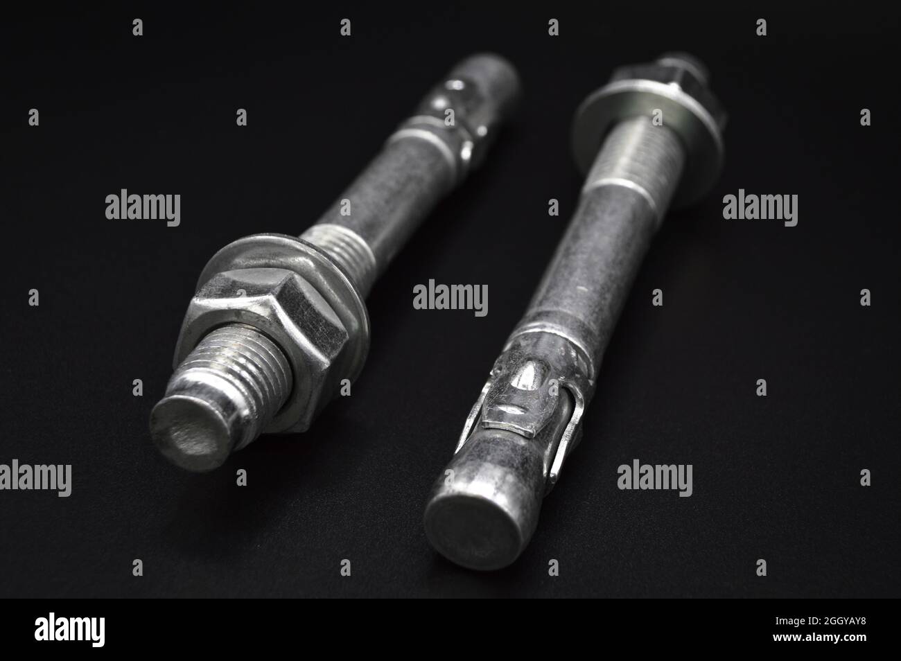 Galvanized steel metal dowel with metric bolt and nut, isolated on ...