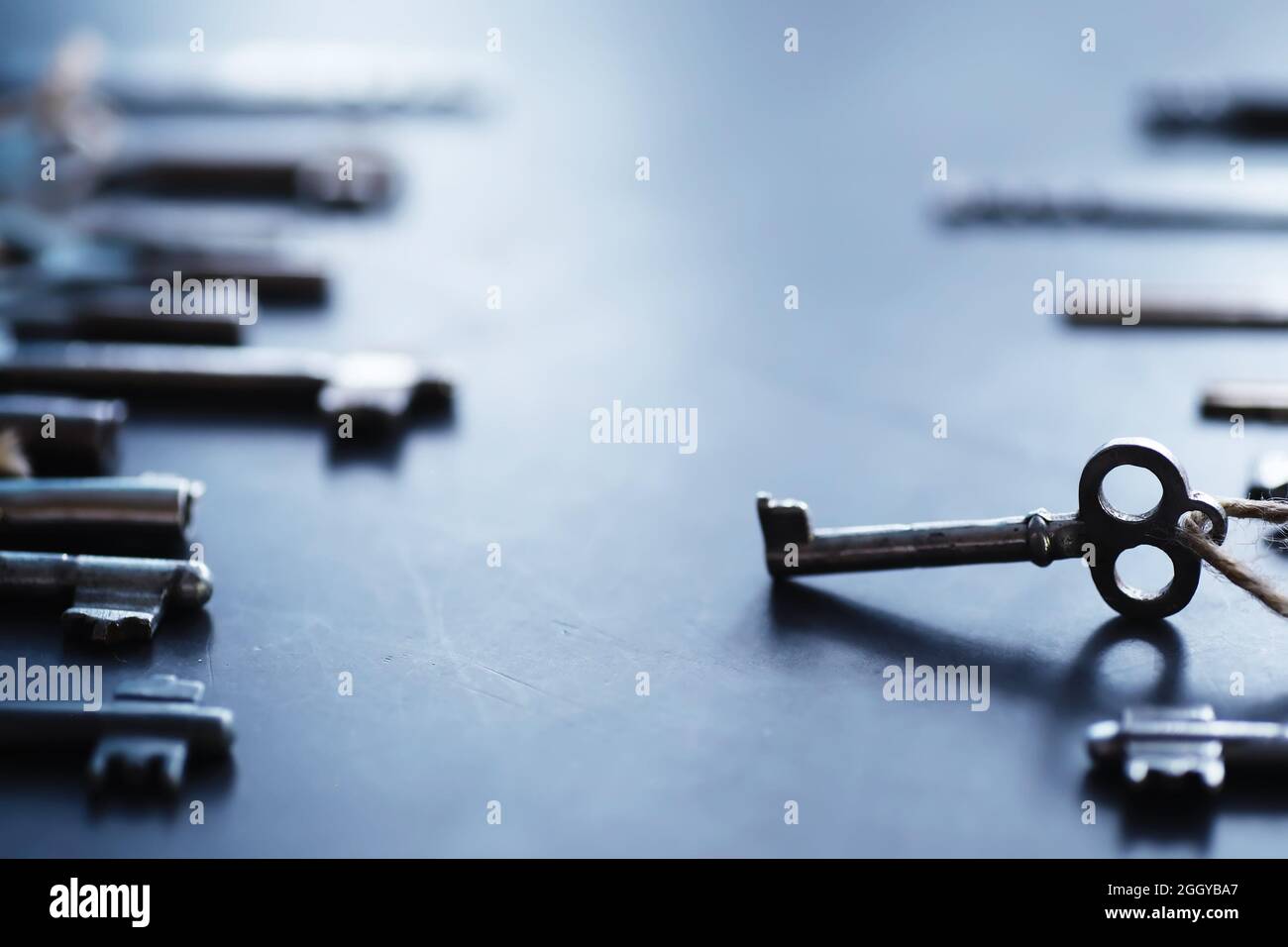 Set of vintage keys for lock. Retro keys on a dark stone background ...