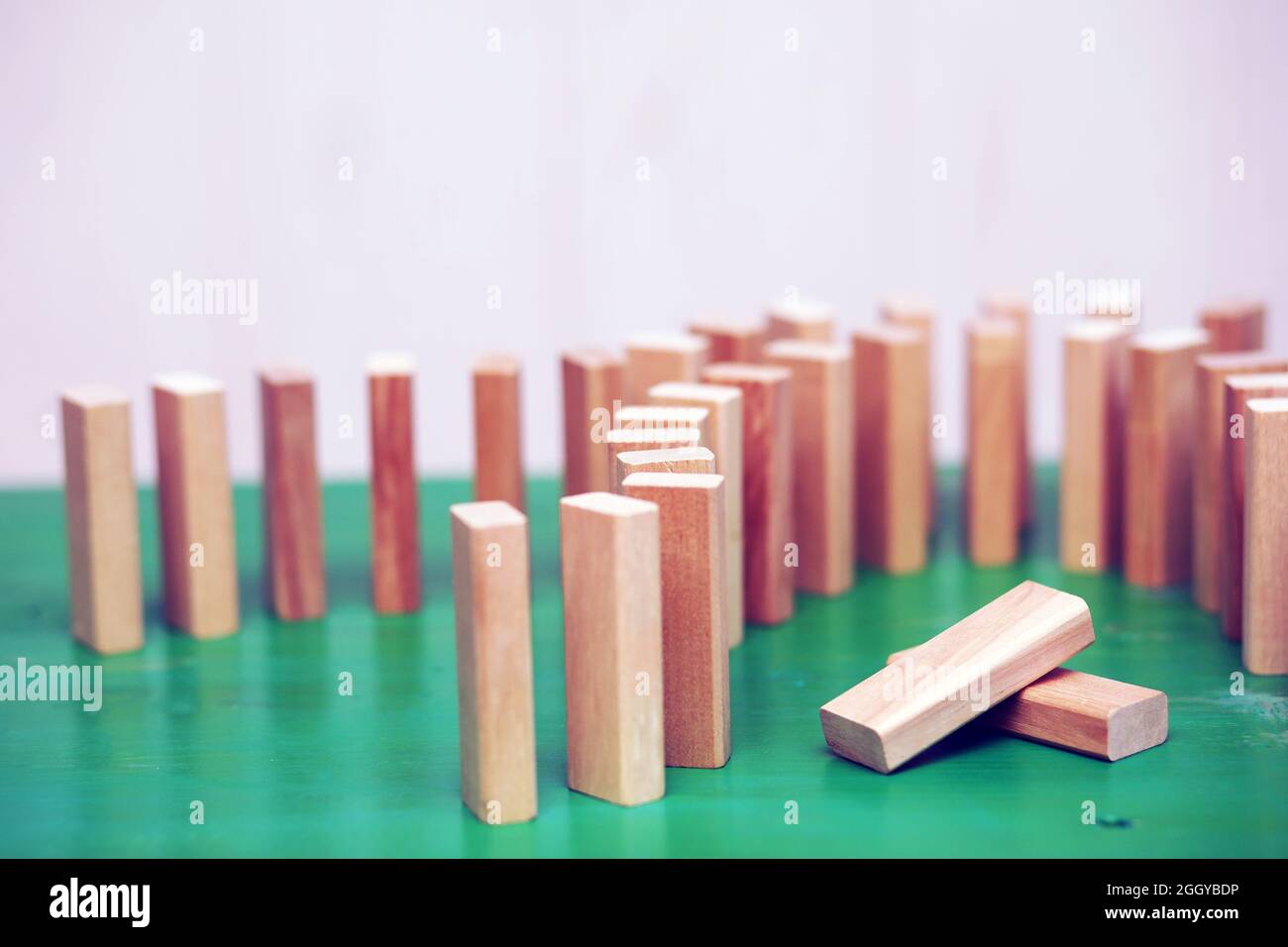 Stick wood block standing on stacked square wood blocks, abstract ...