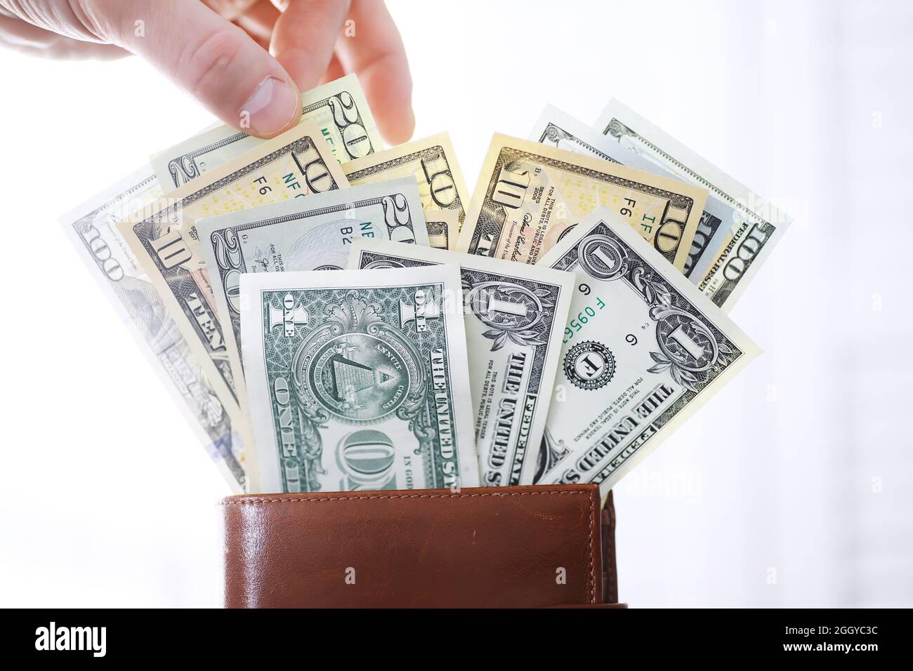 Cash money in a large pile as a finance background. Paper money close ...