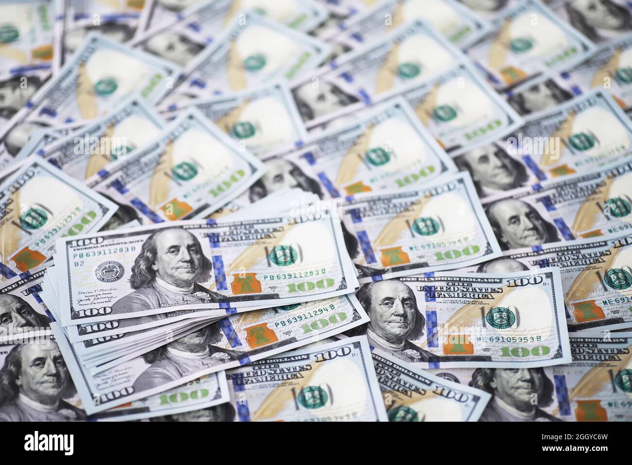 Cash money in a large pile as a finance background. Paper money close ...