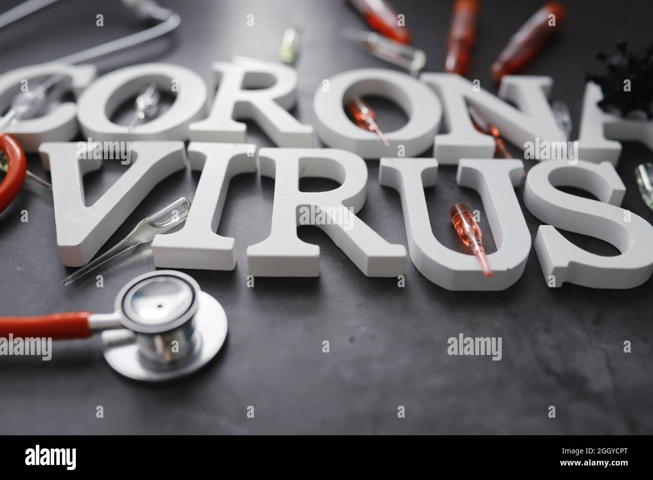 Medical background. Lettering virus. Coronavirus wooden letters ...