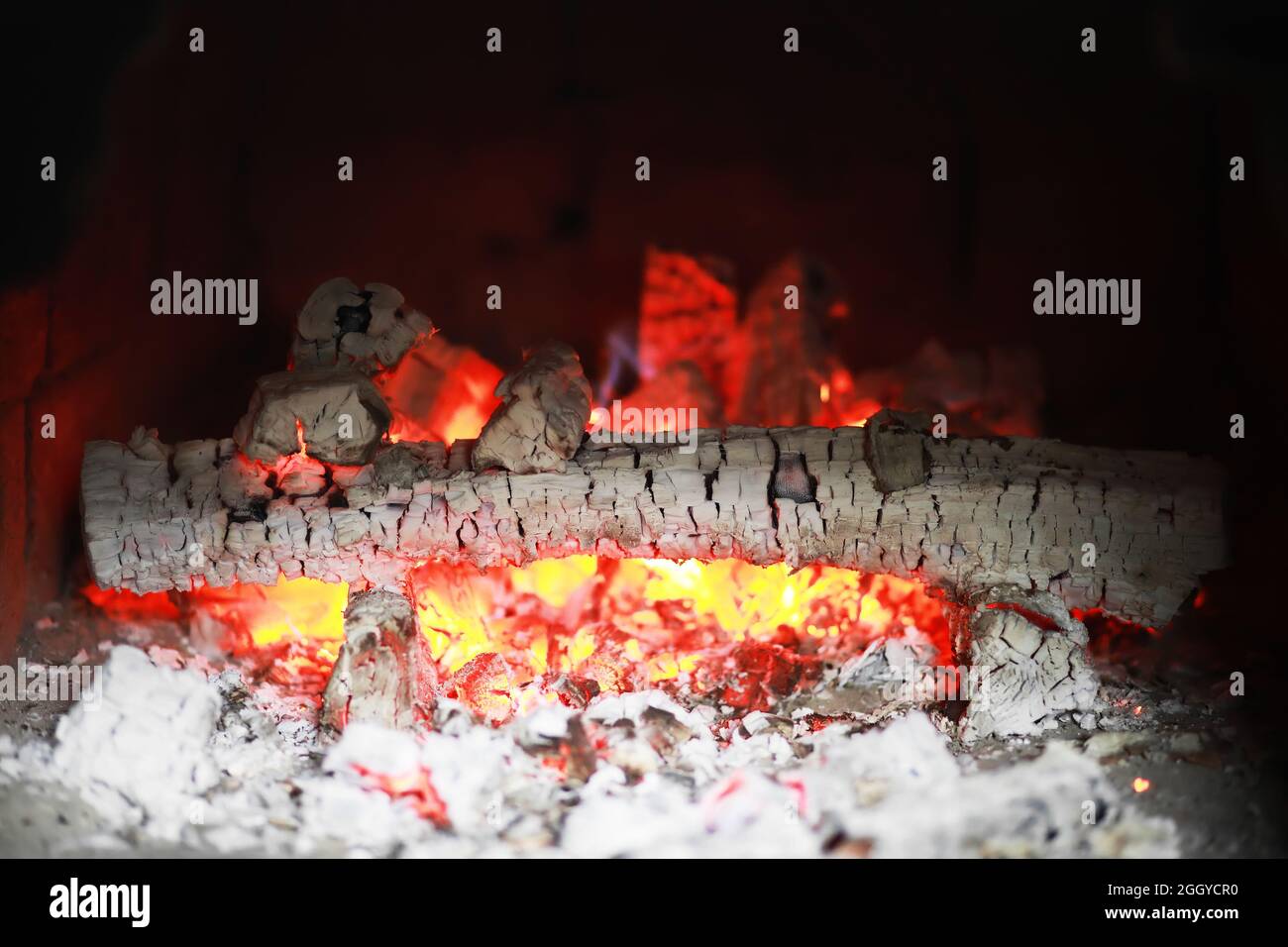 Burning red hot sparks fly from big fire. Burning coals, flaming ...