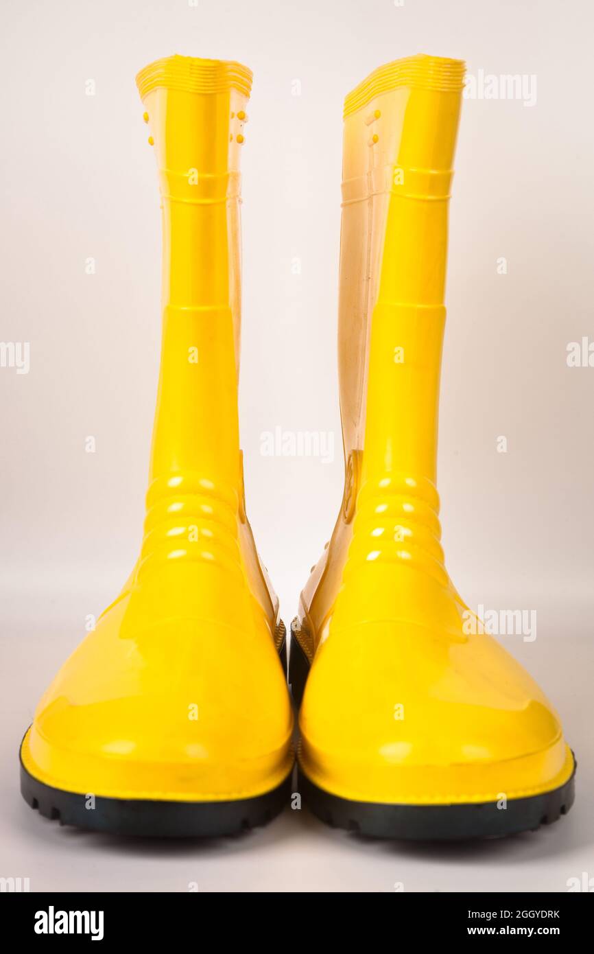 Robust and waterproof yellow rubber boots isolated on white background ...