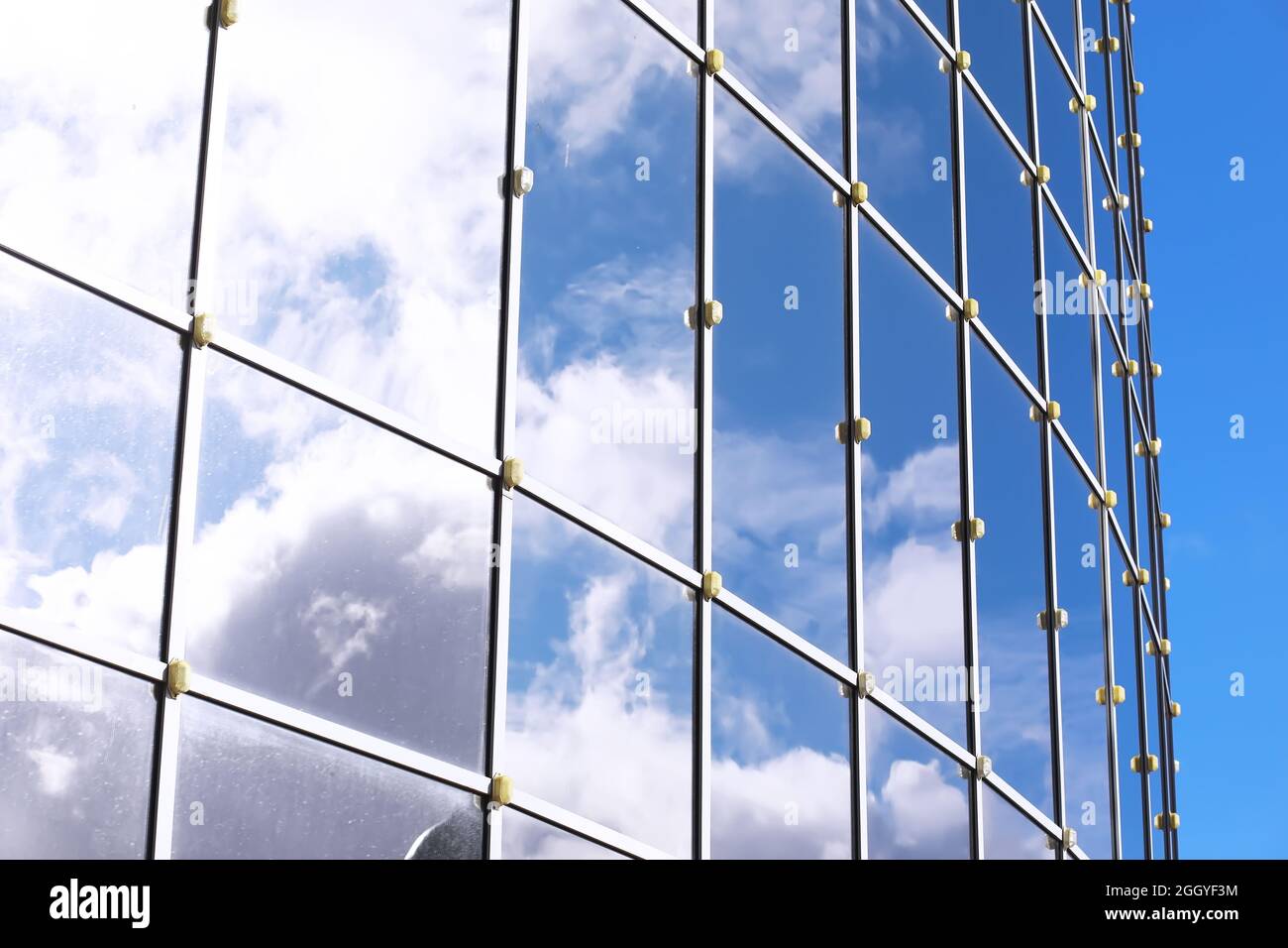 Architectural detail of the facade with multiple reflections of other ...